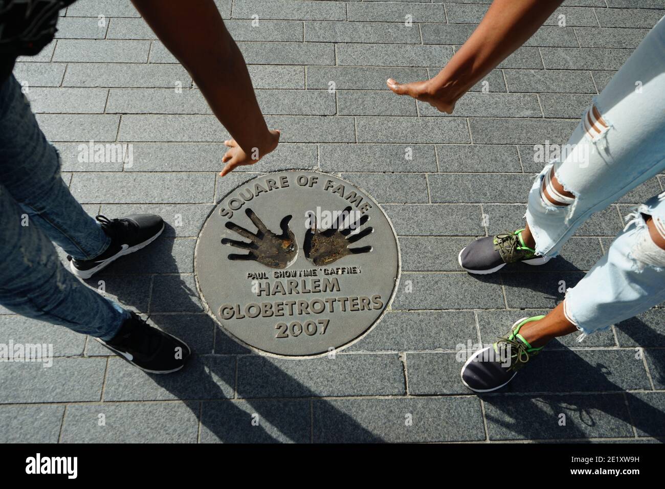 Fingers of Harlem Globetrotters printed in the ground at Wembley Park ...