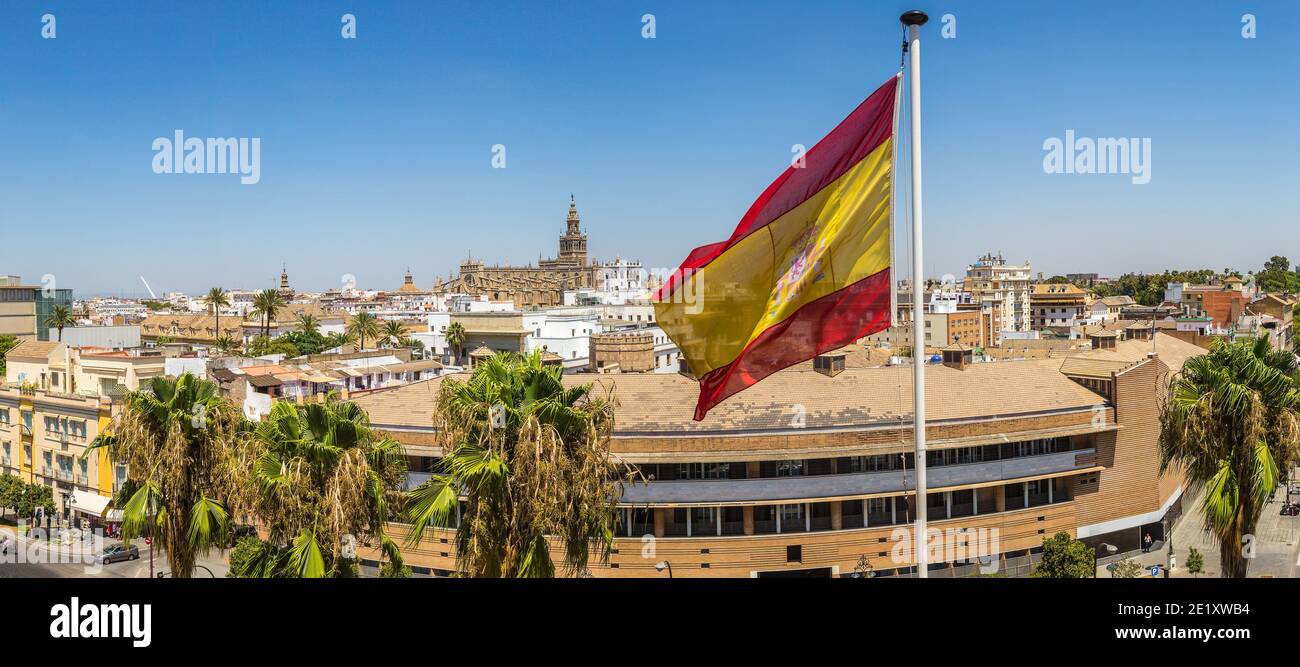 Spain flag and panoramic aerial view of Sevilla in a beautiful summer ...