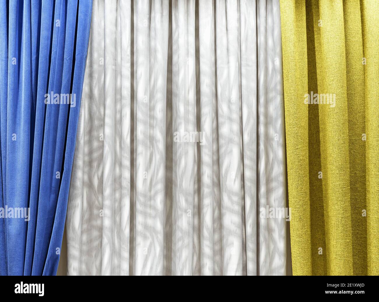 Blue and yellow curtains on the living room window. Multi-colored ...