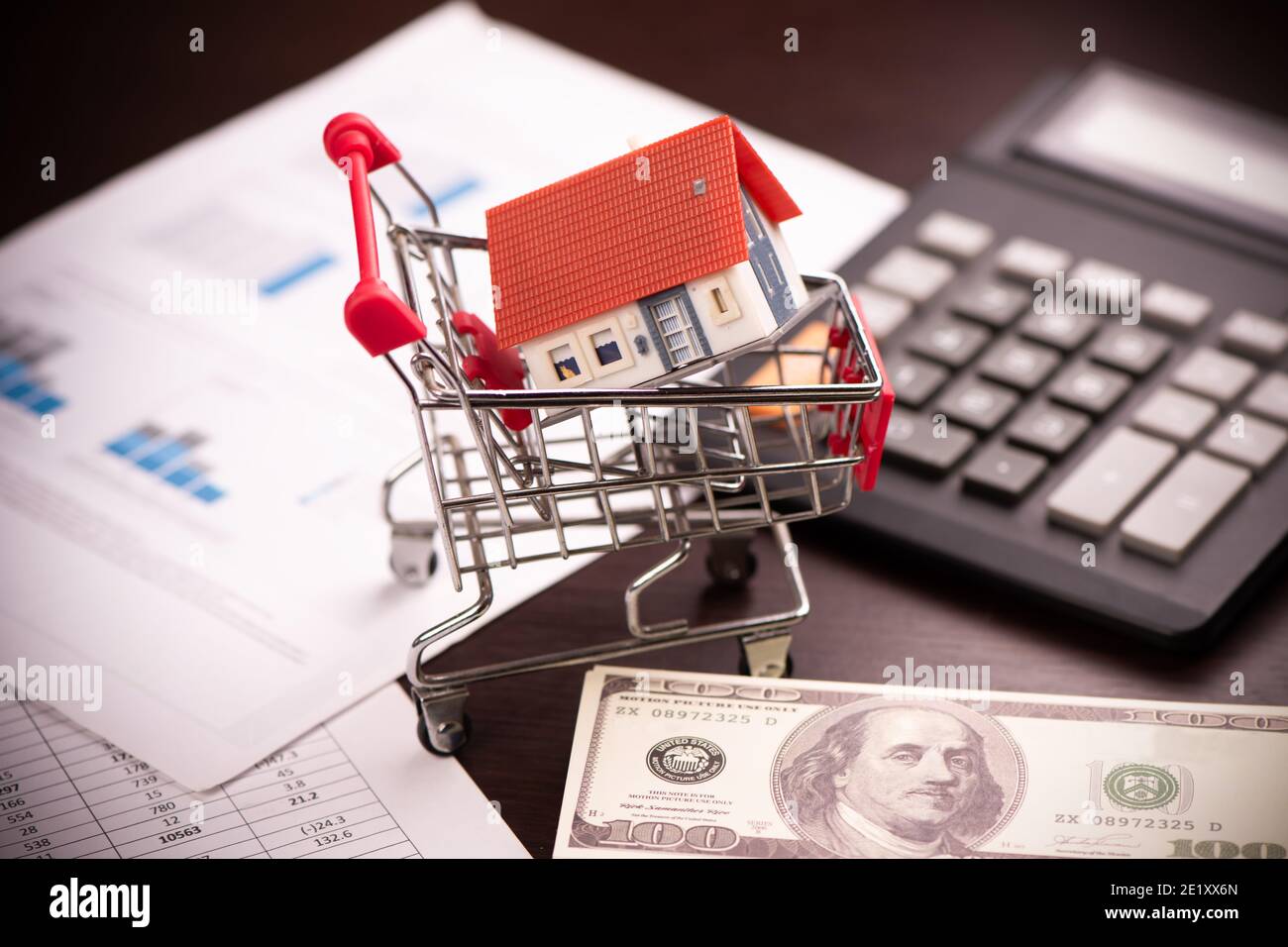 Shopping cart and model of house. Real estate investment trusts Stock ...