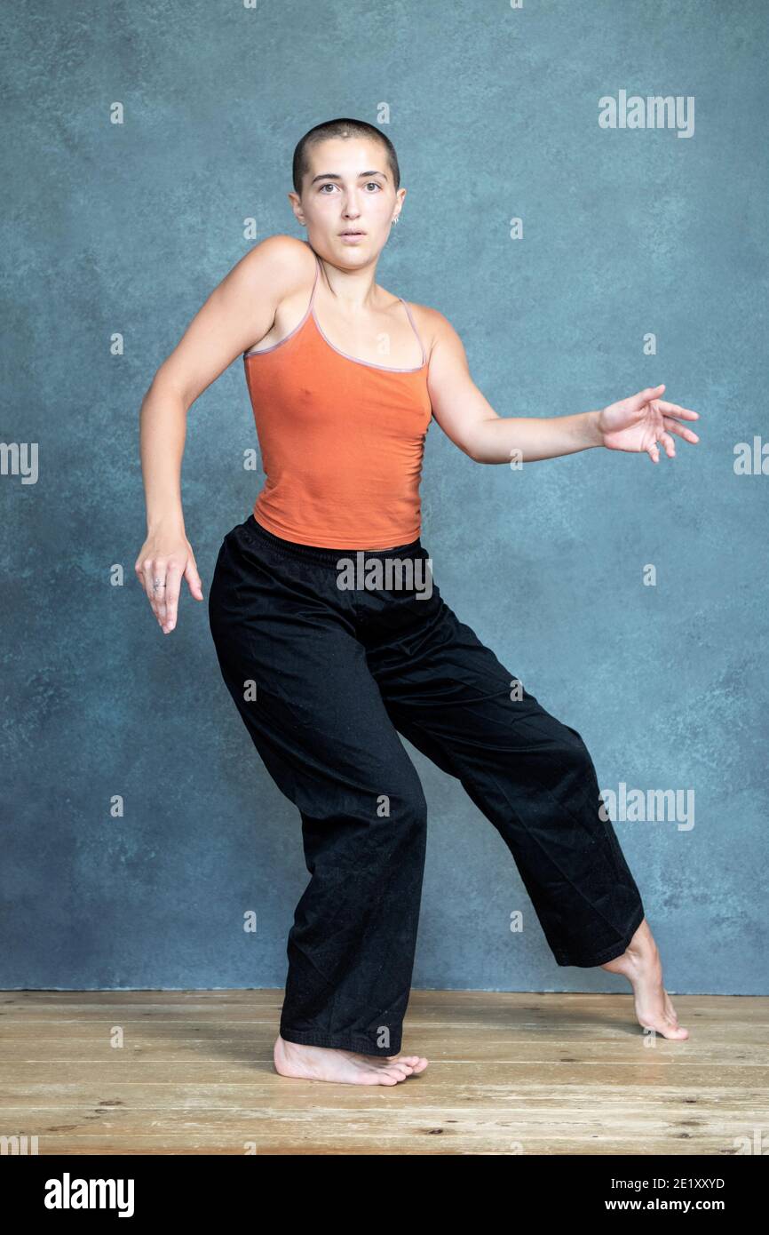 Non-binary, gender neutral, biological female with shaved head in ...