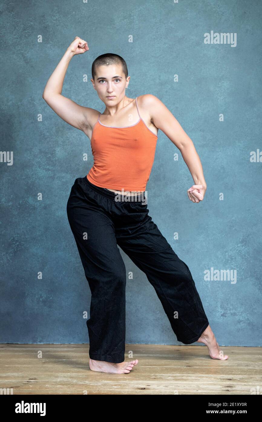 Non-binary, gender neutral, biological female with shaved head in ...