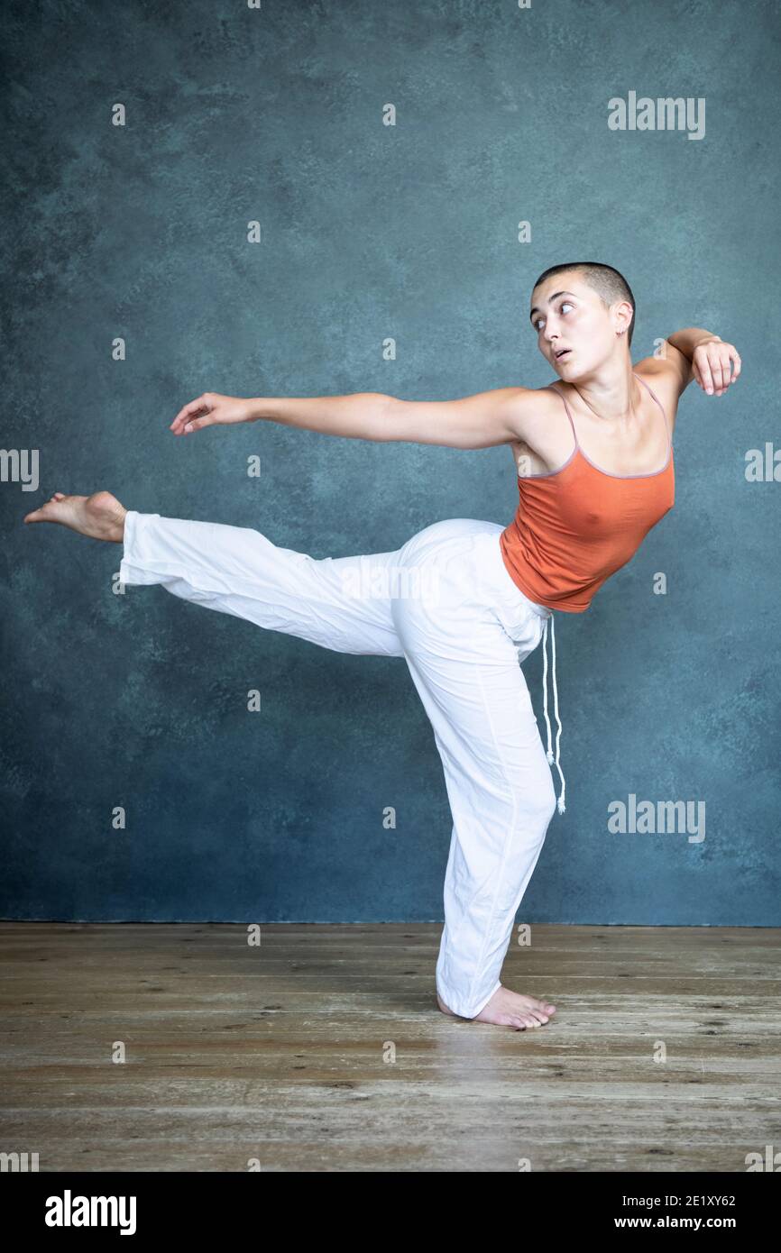 Non-binary, gender neutral, biological female with shaved head in ...