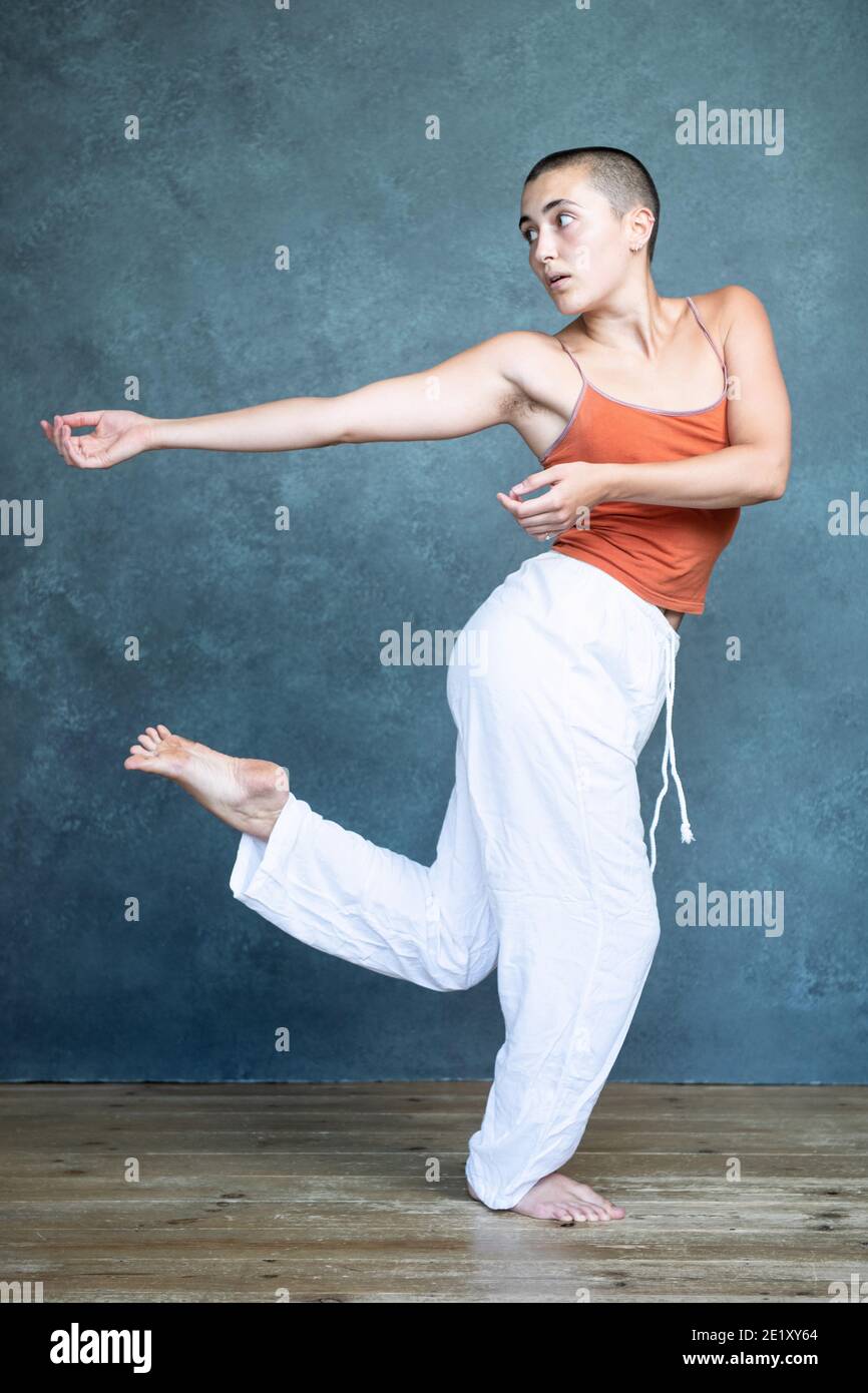 Non-binary, gender neutral, biological female with shaved head in ...