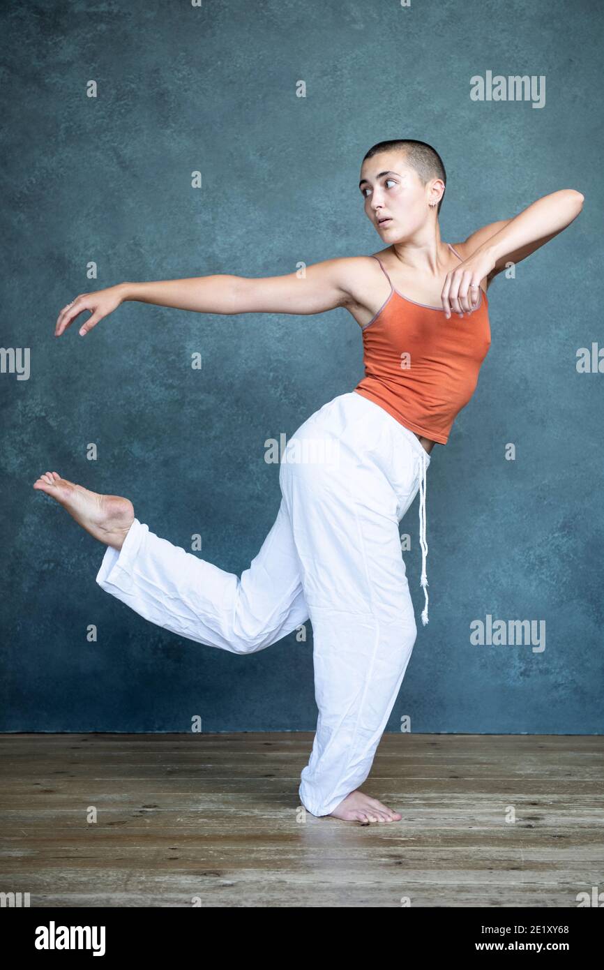 Non-binary, gender neutral, biological female with shaved head in ...