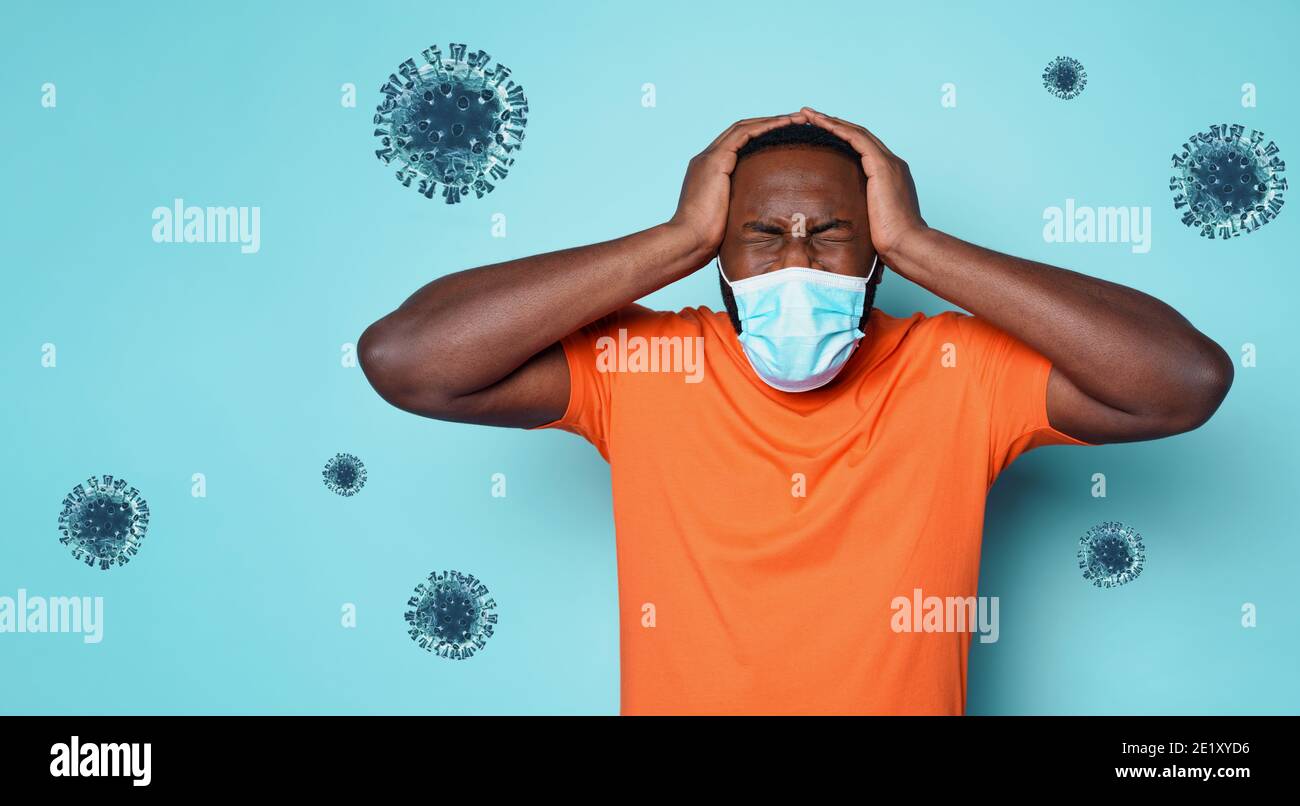 Boy with face mask is tired and stressed of covid 19. cyan background ...