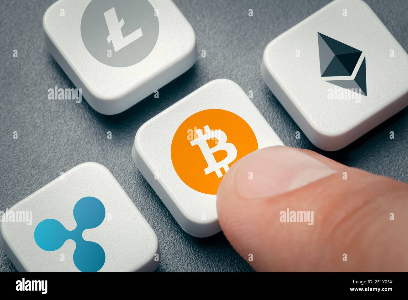 finger pressing cursor key with bitcoin symbol. ethereum, ripple and ...