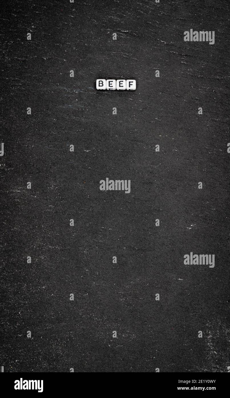 Word beef on black stone background Stock Photo - Alamy