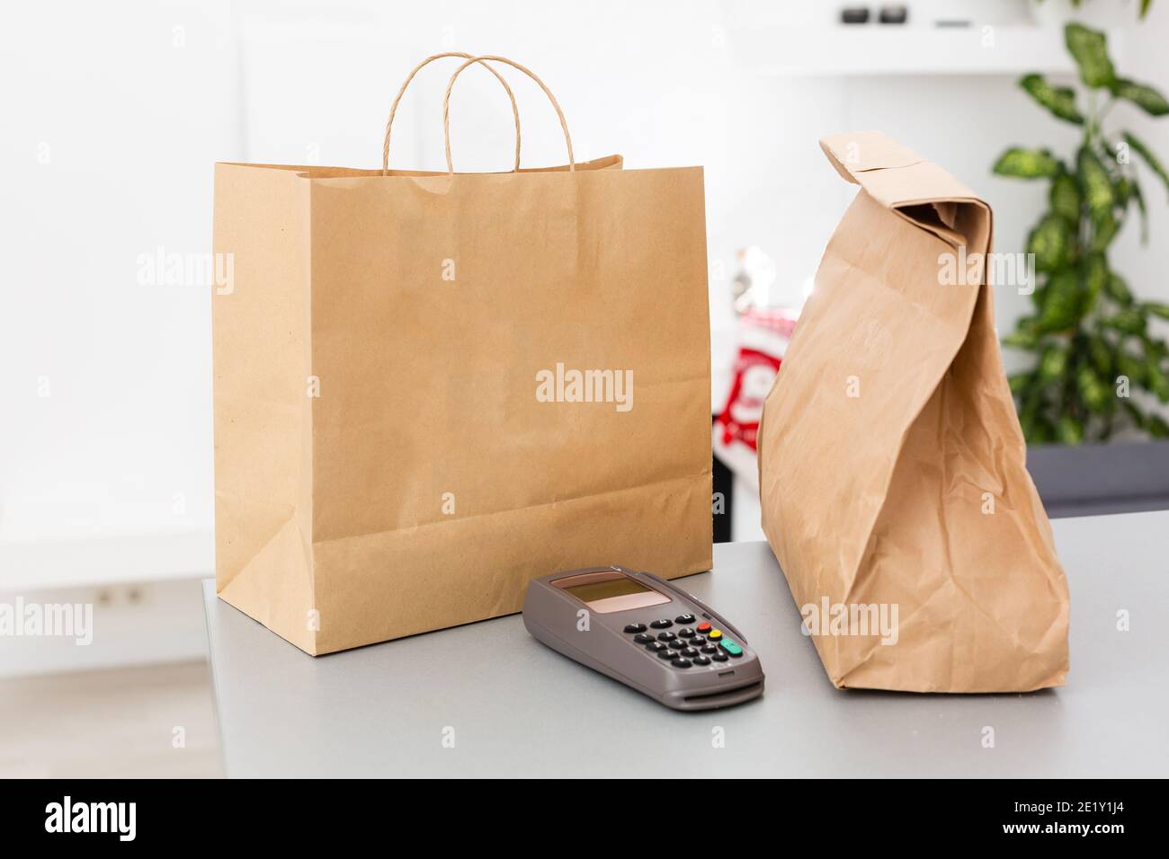 pos terminal and package delivery, parcel delivery Stock Photo - Alamy