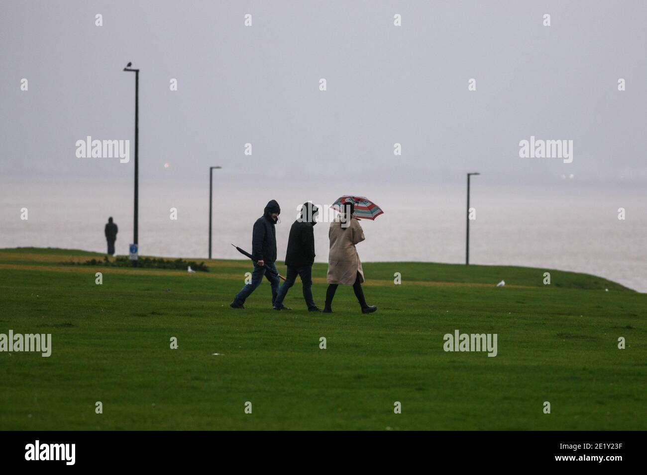Liverpool, UK - November 1 2020: People brave high winds at Otterspool ...