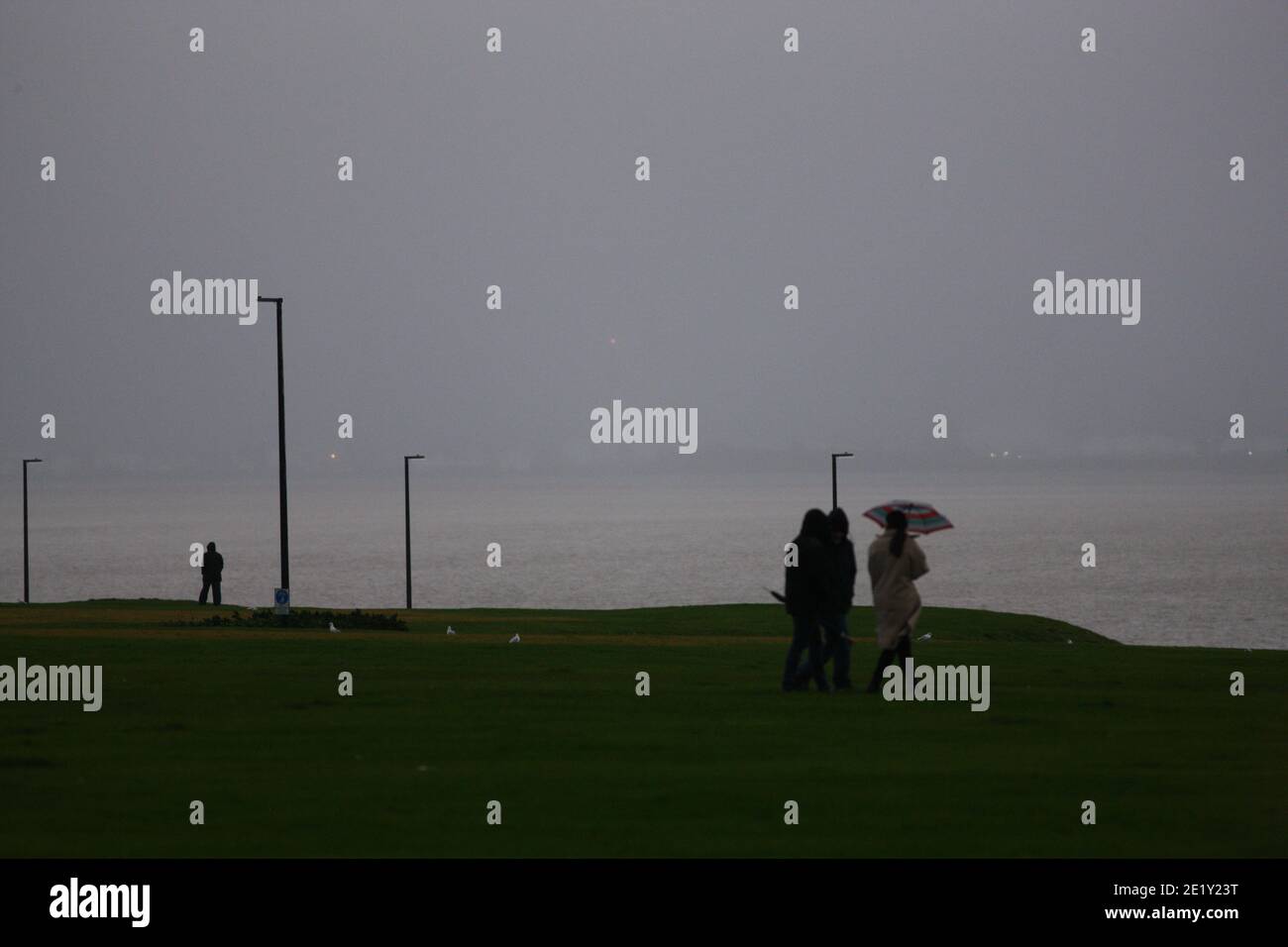 Liverpool, UK - November 1 2020: People brave high winds at Otterspool ...