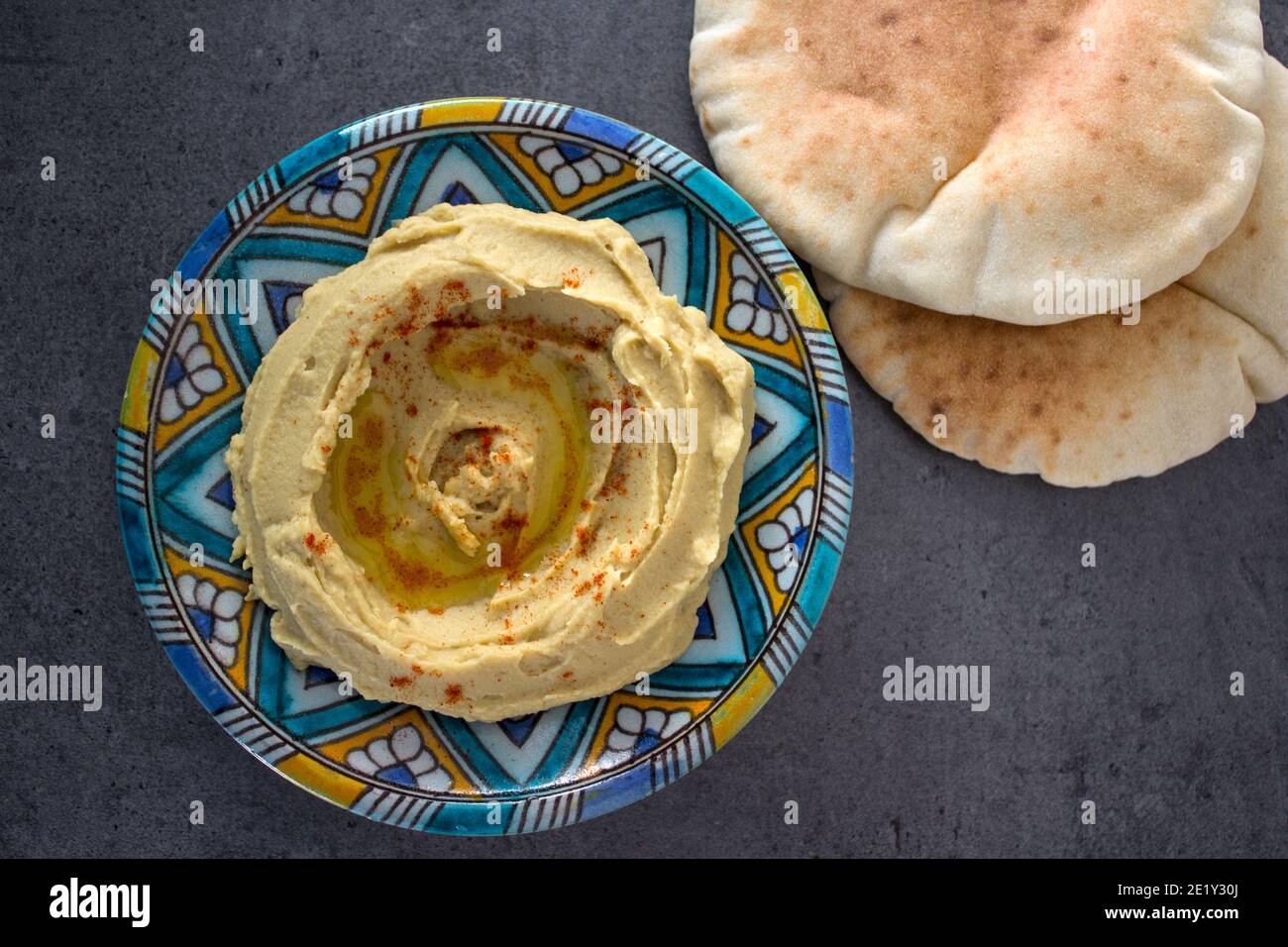Tasty hummus on colorful plate. Top view photo of traditional food of ...