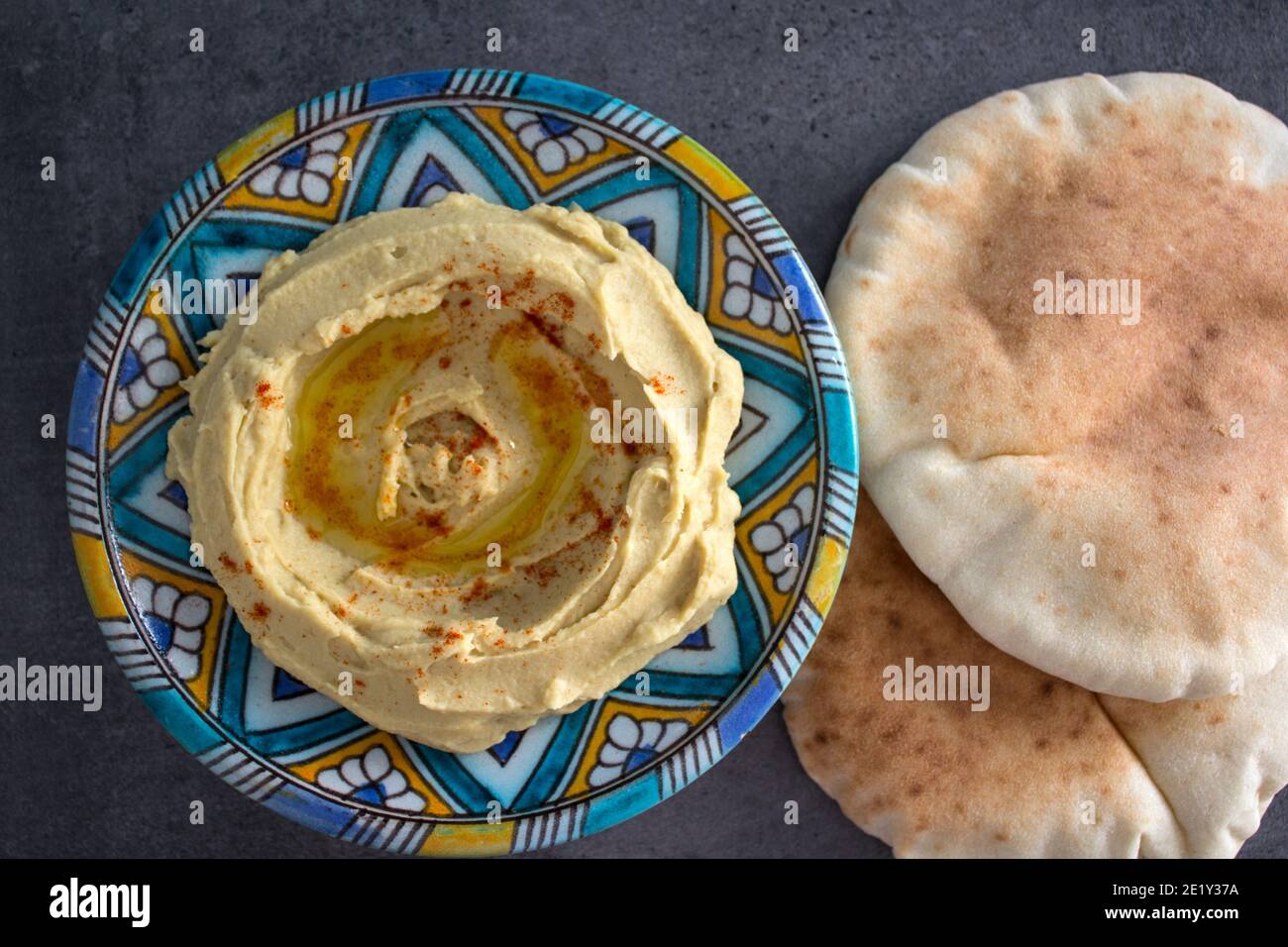 Tasty hummus on colorful plate. Top view photo of traditional food of ...