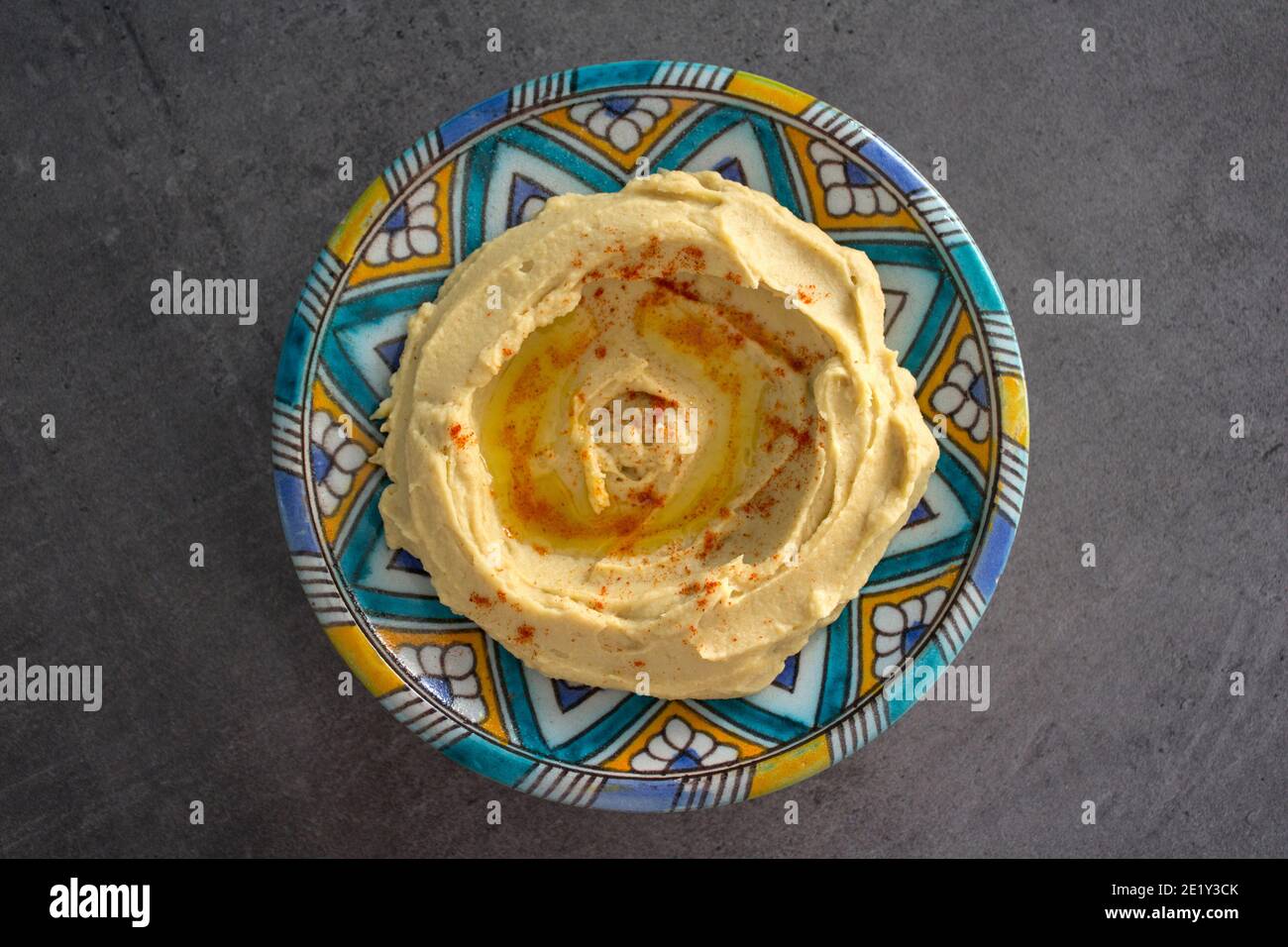 Tasty hummus on colorful plate. Top view photo of traditional food of ...
