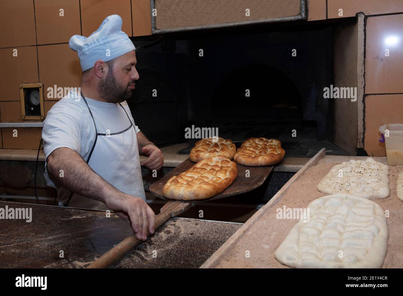 Daily production of bread baked with wood oven with traditional method ...