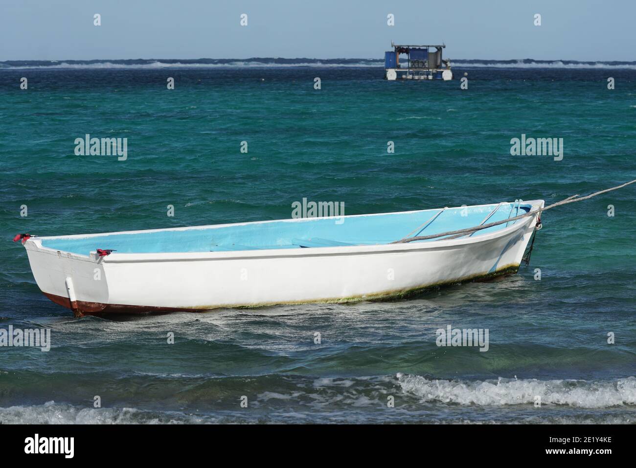 rowing boat moored in the sea in front of a floating jetty in Mauritius ...