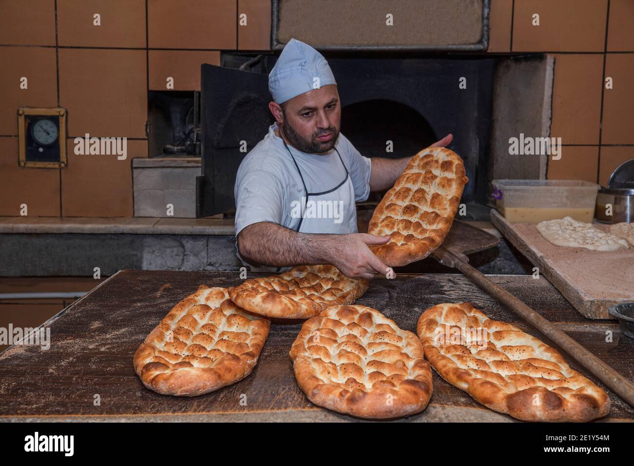 Daily production of bread baked with wood oven with traditional method ...
