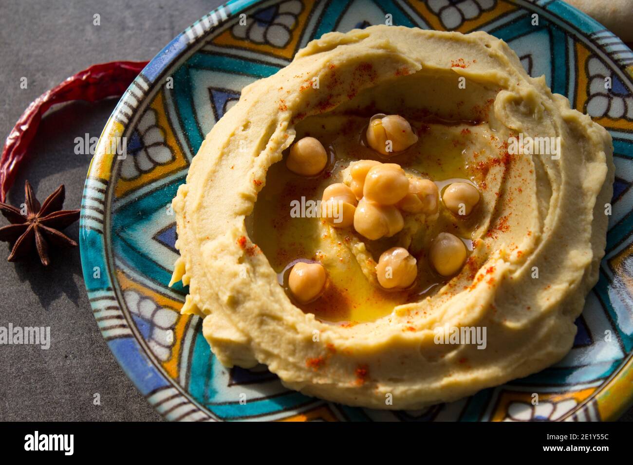 Tasty hummus on colorful plate. Top view photo of traditional food of ...