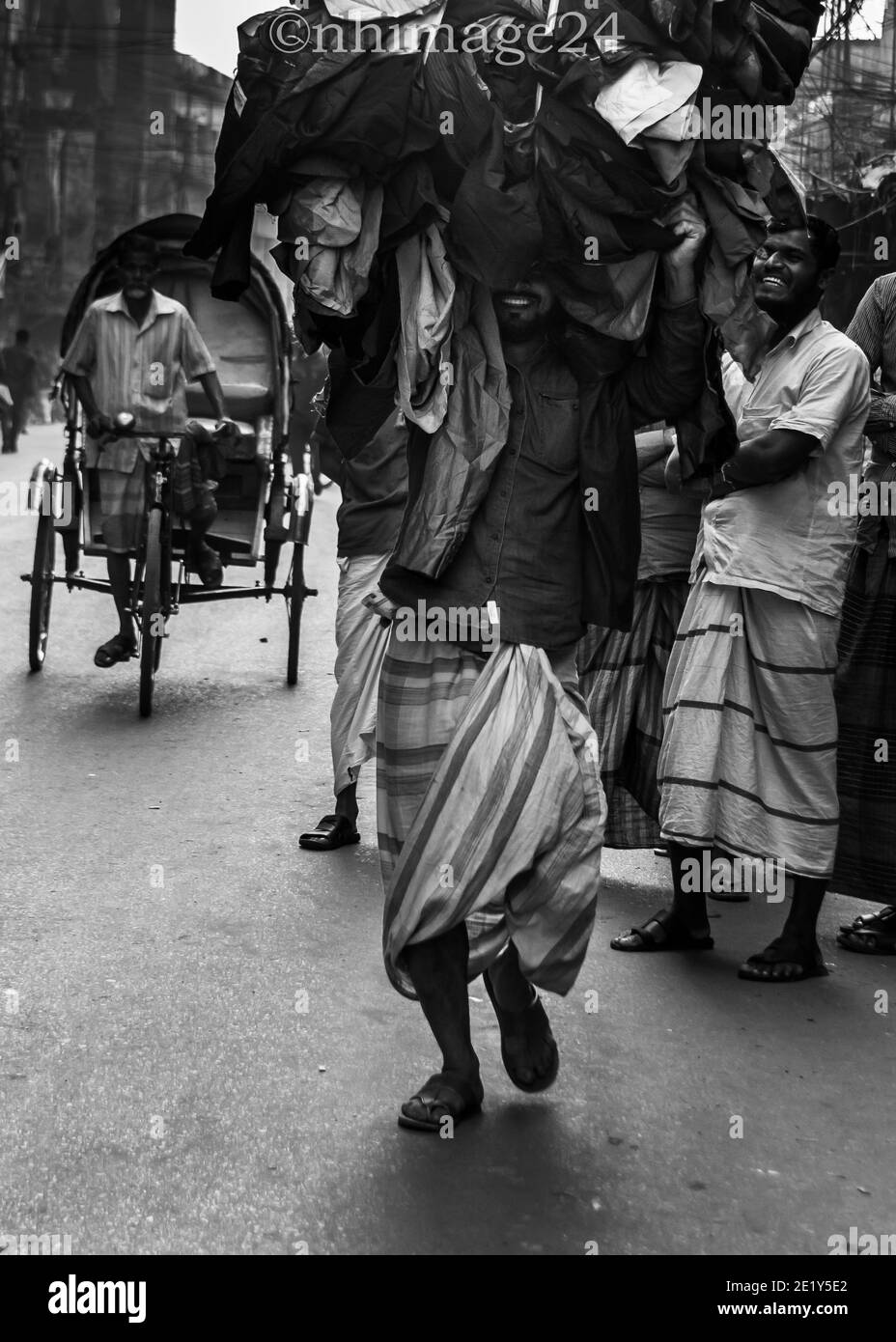 The smile of a day laborer with heavyweight, but he is happy as he ...