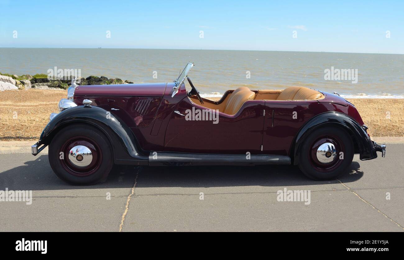 Vintage Dark red Rover Motor Car parked on seafront promenade Stock ...