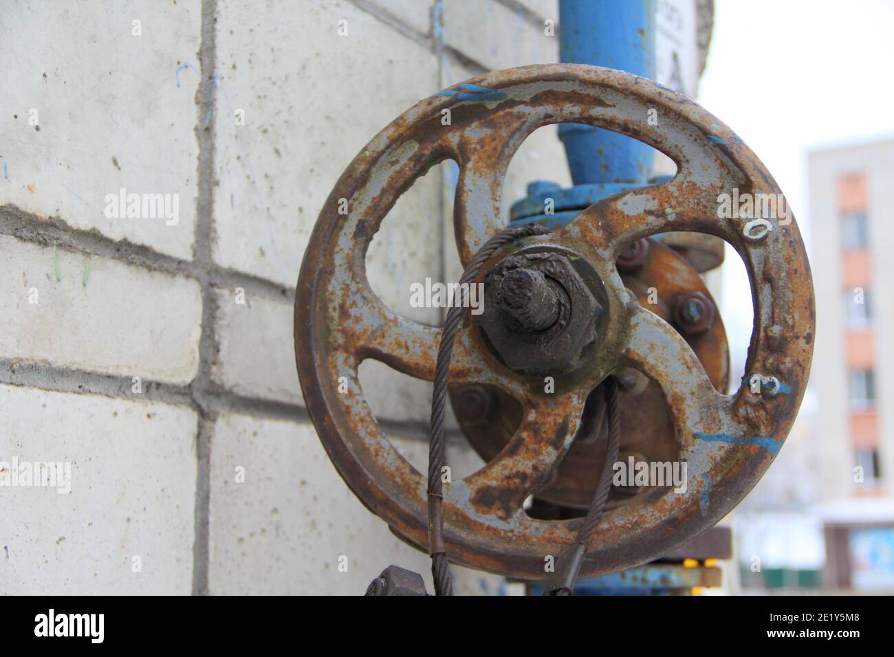Old damaged and rusty iron oil pipe valve wheel. Metal, pipeline and ...