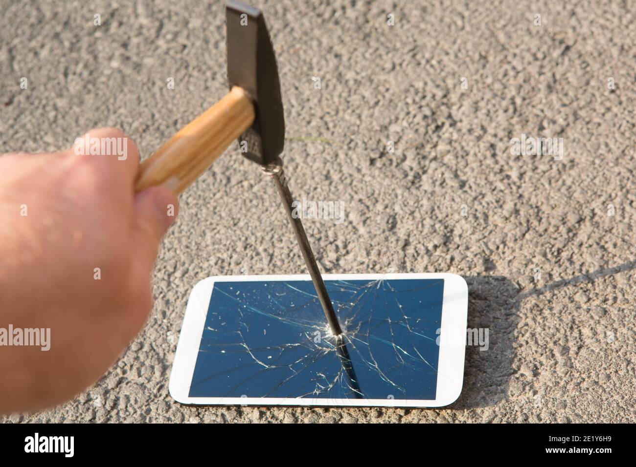 hammer smashing the screen of a smartphone Stock Photo - Alamy