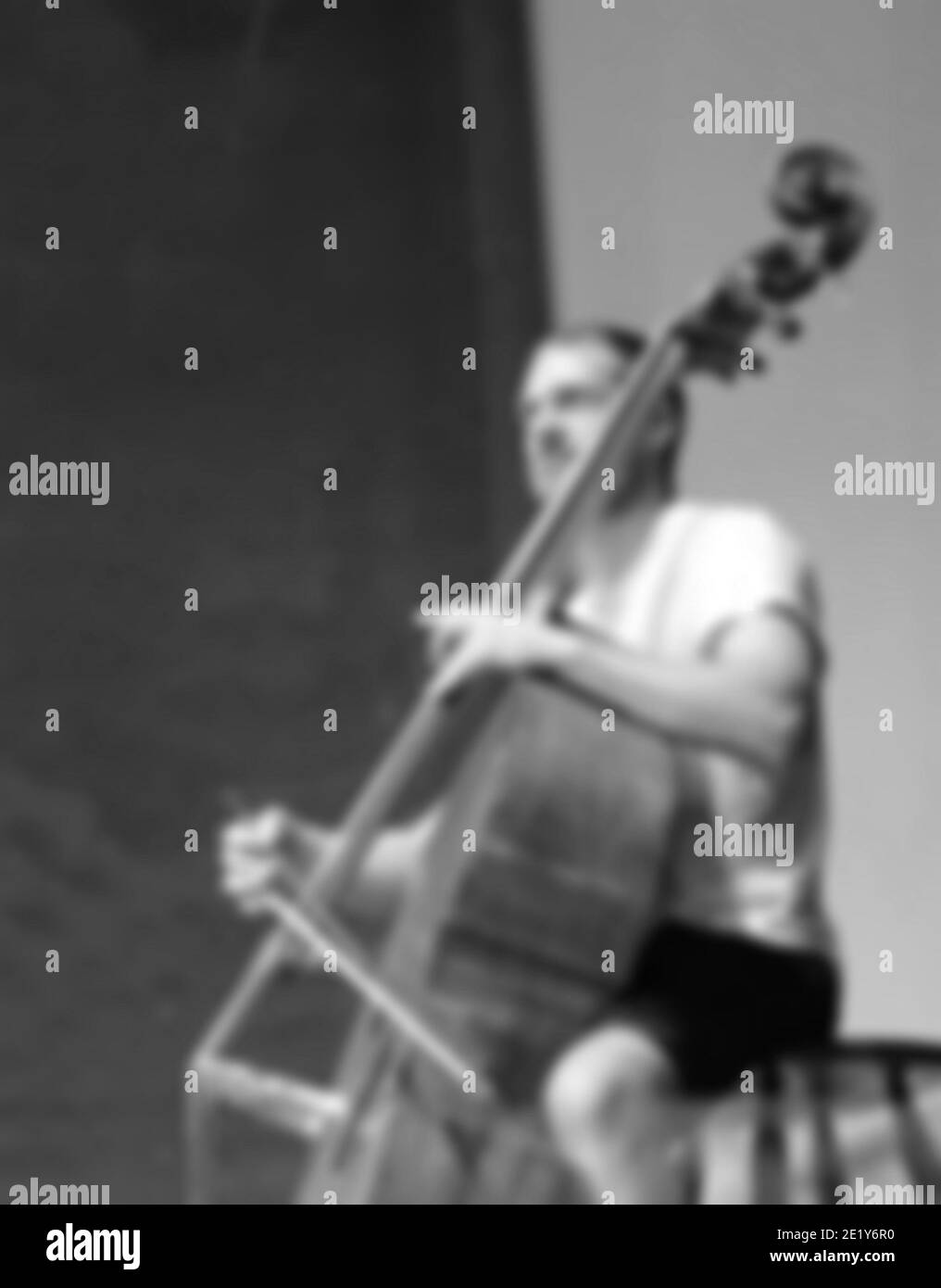 Symphony orchestra on stage, hands playing cello. Professional cello ...