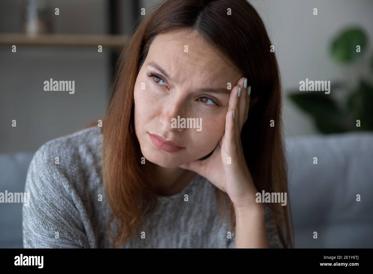 Sad young woman look in distance missing or thinking Stock Photo - Alamy