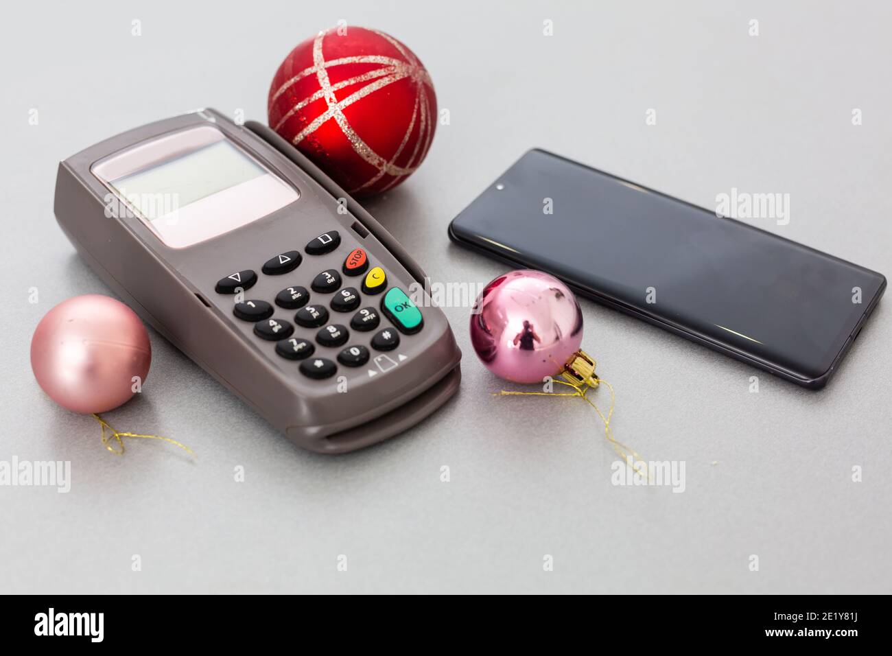 Customer using mobile phone to pay by NFC Stock Photo - Alamy