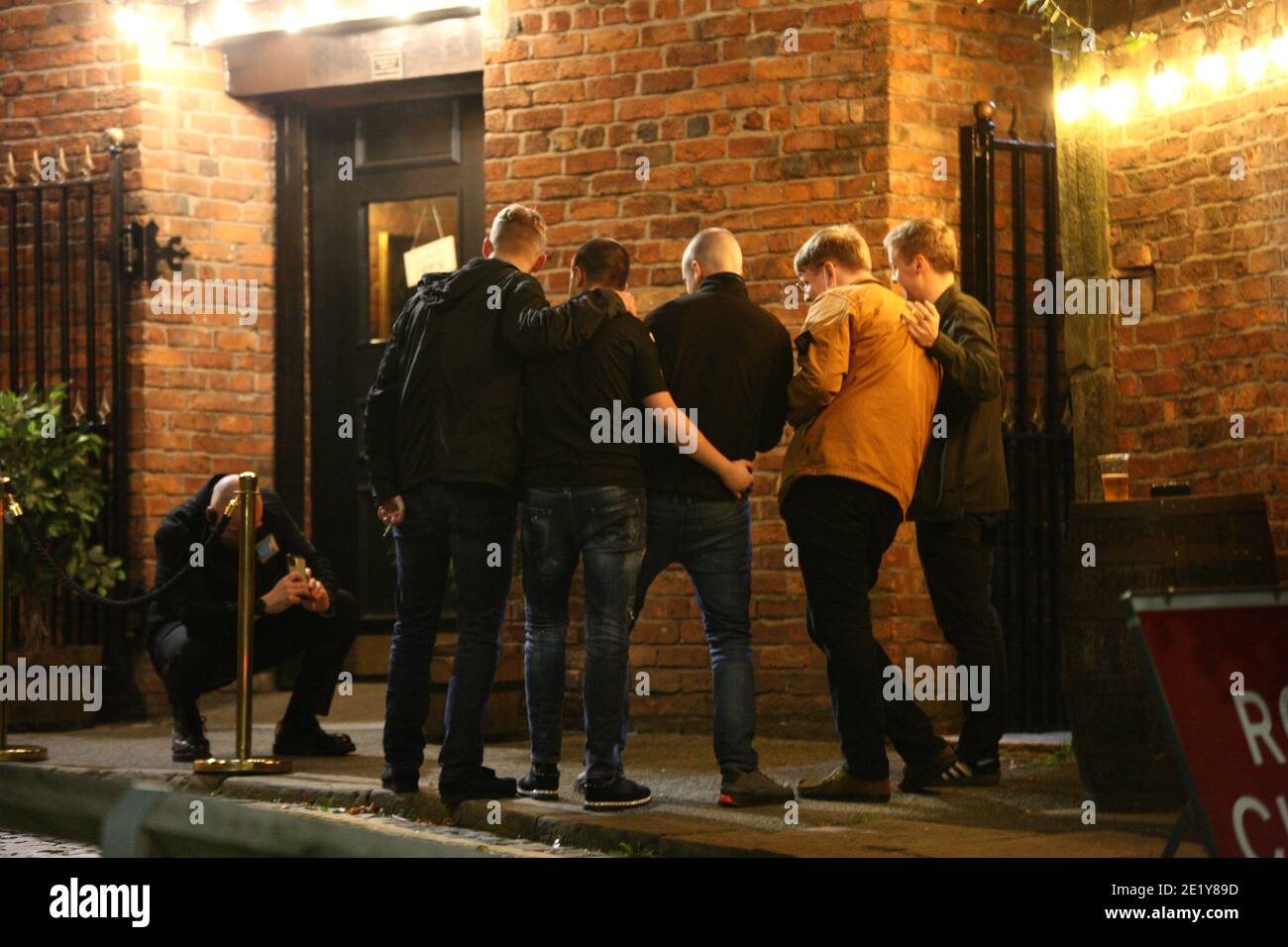 Manchester, UK - October 17 2020: A group of men pose for a photograph ...