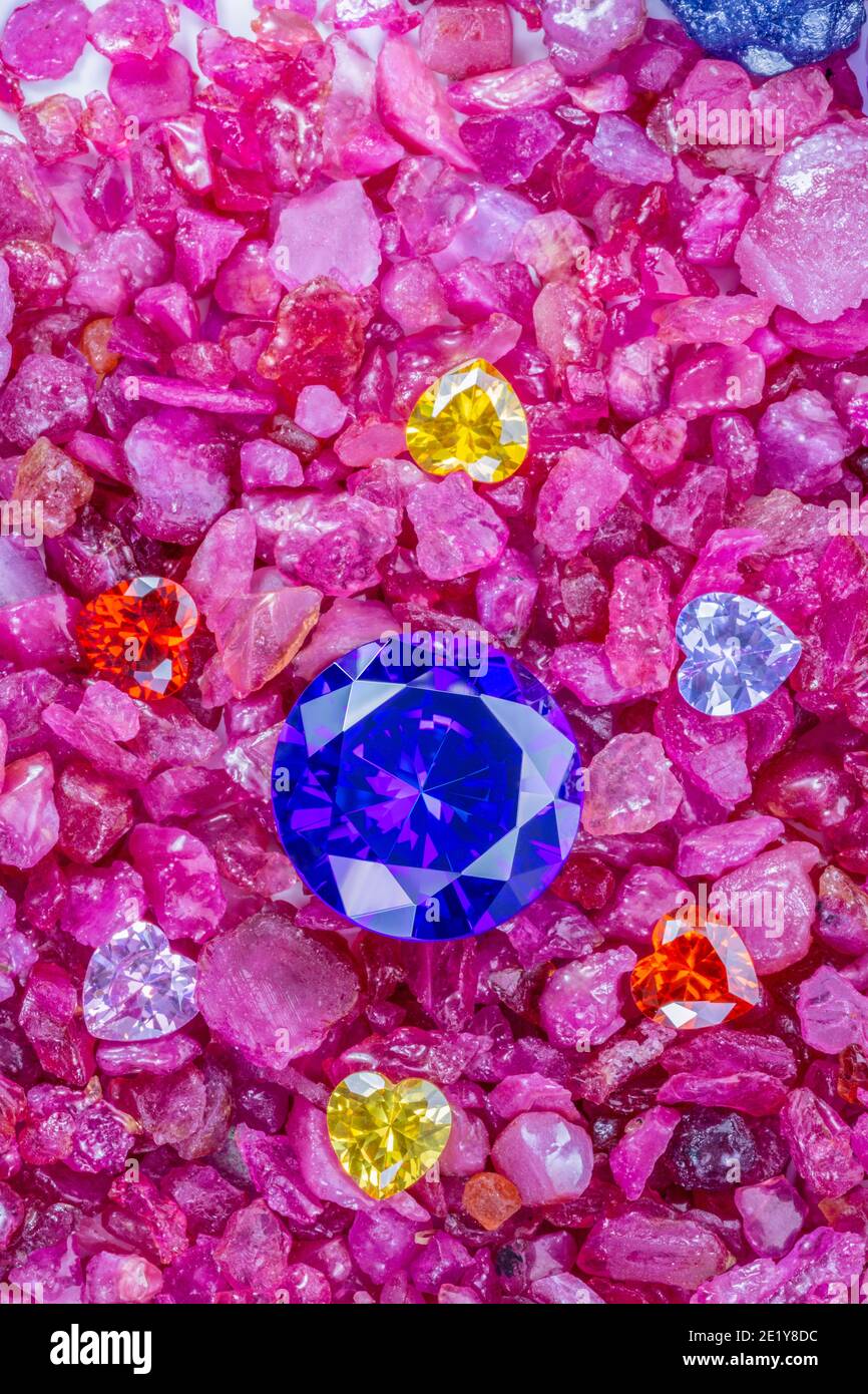 Blue Sapphire diamonds are placed in an enclave of colorful heart ...