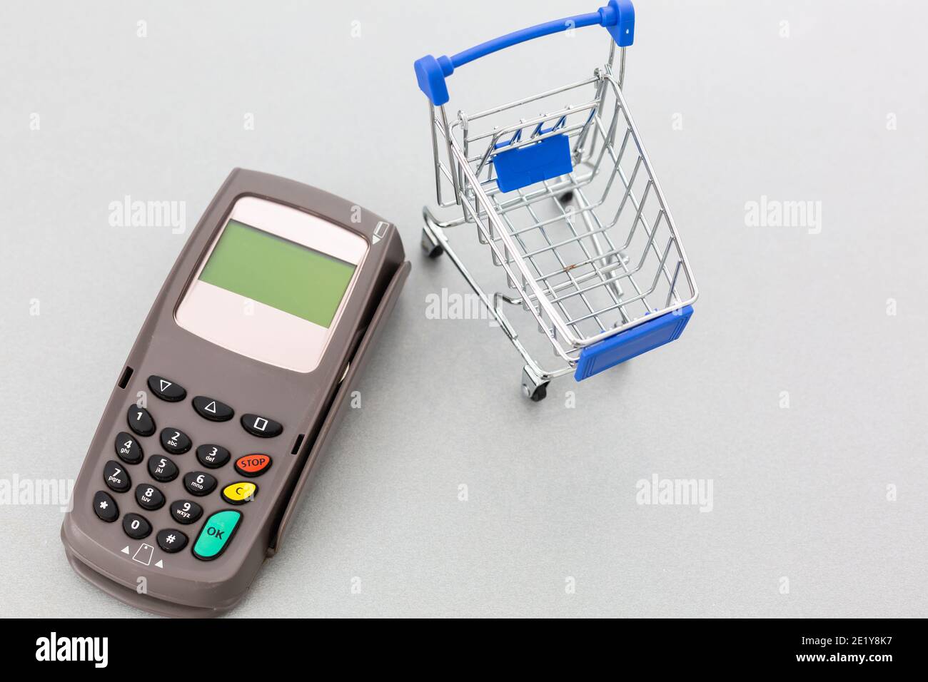 Top view photo of shopping trolley and cash register Stock Photo - Alamy