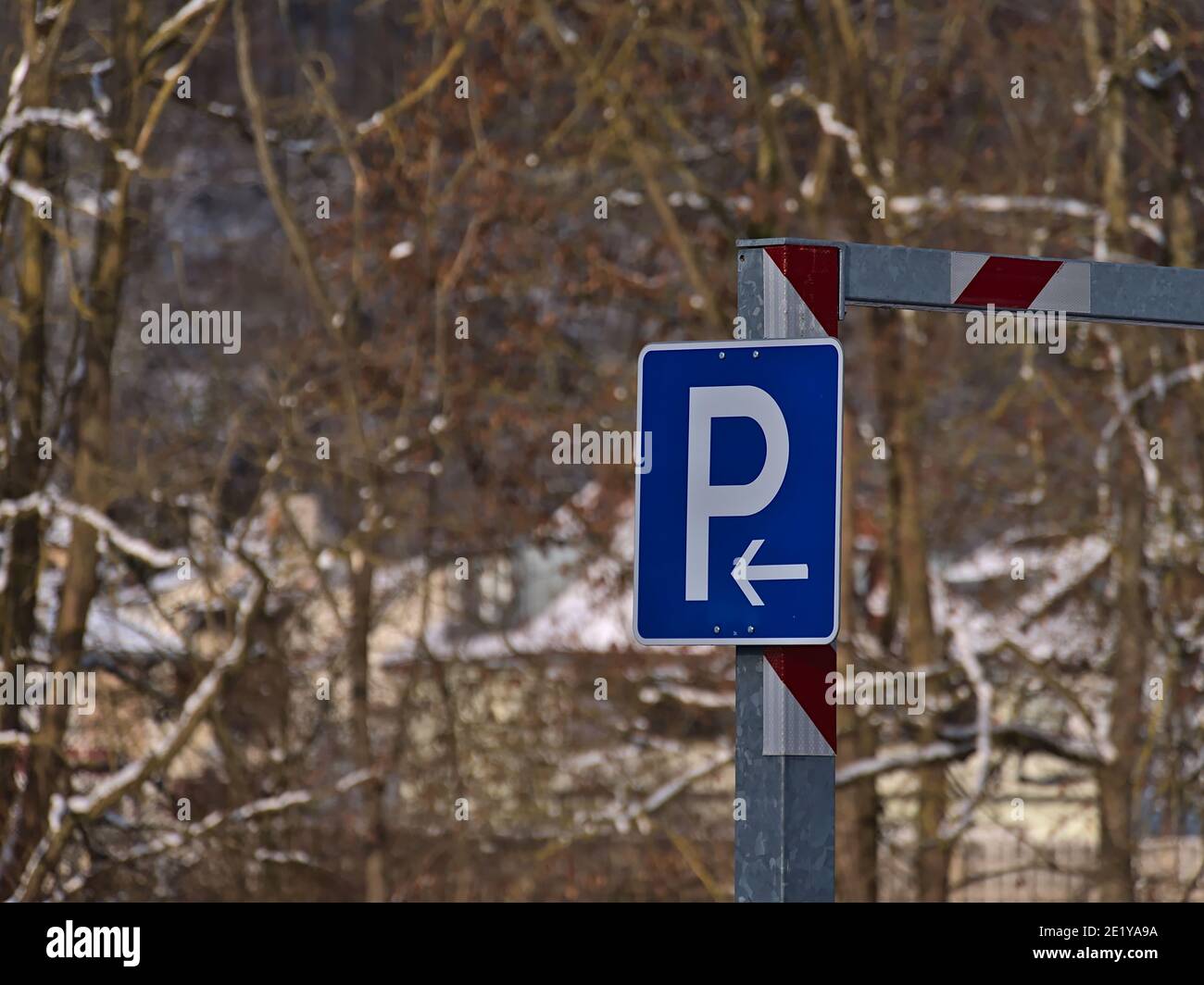 Blue colored parking sign with white "P" letter and arrow symbol (left ...