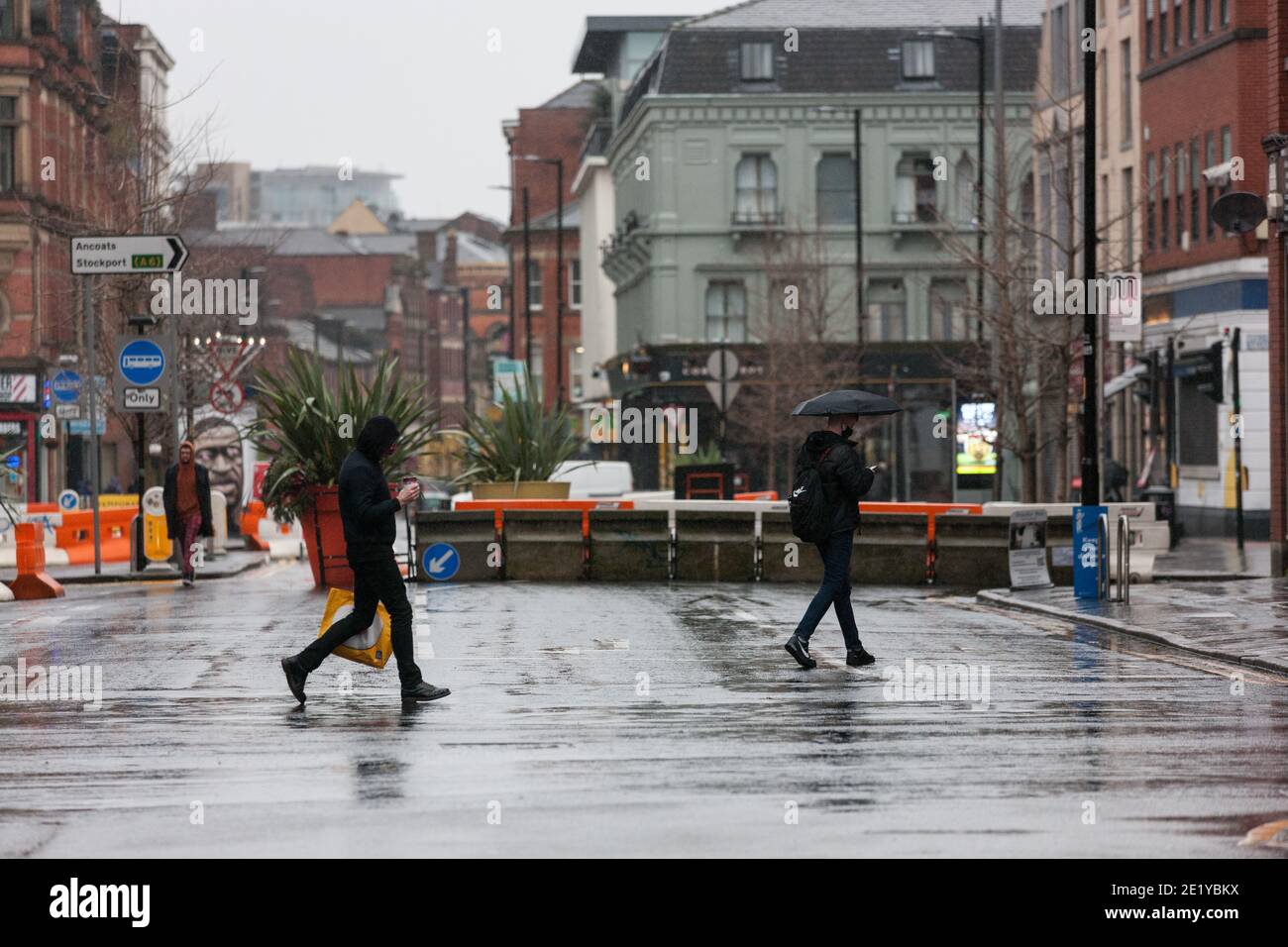 People walk through the rain in Manchester's Northern Quarter Stock ...