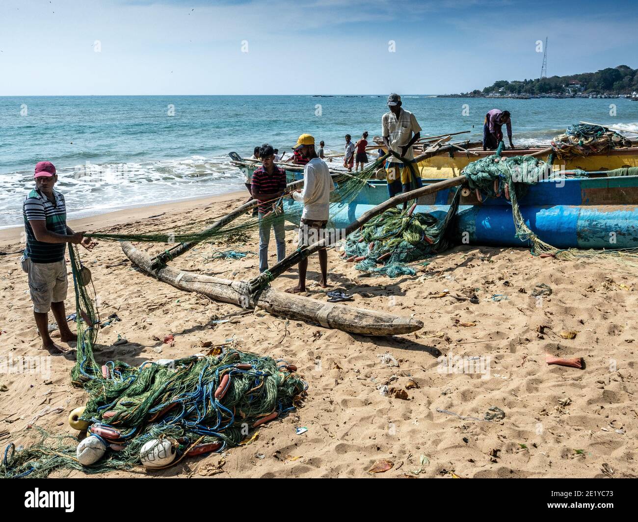 TANGALA, SRI LANKA - March 15, 2019: Asian fishermen preparing nets for ...