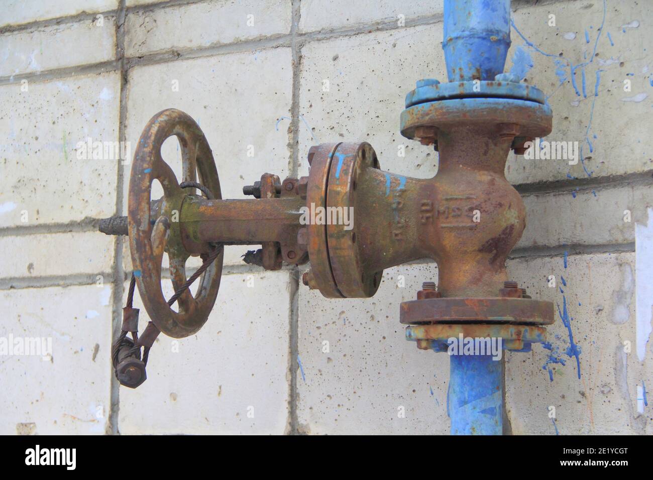 Old damaged and rusty iron oil pipe valve wheel. Metal, pipeline and ...