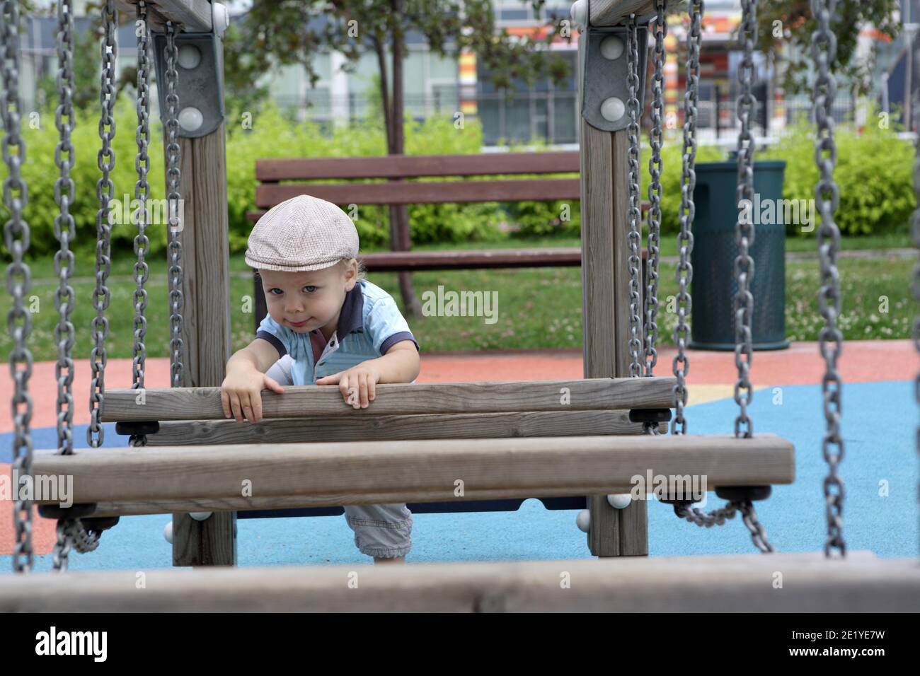 Child climbing wooden obstacle at an playground Stock Photo - Alamy