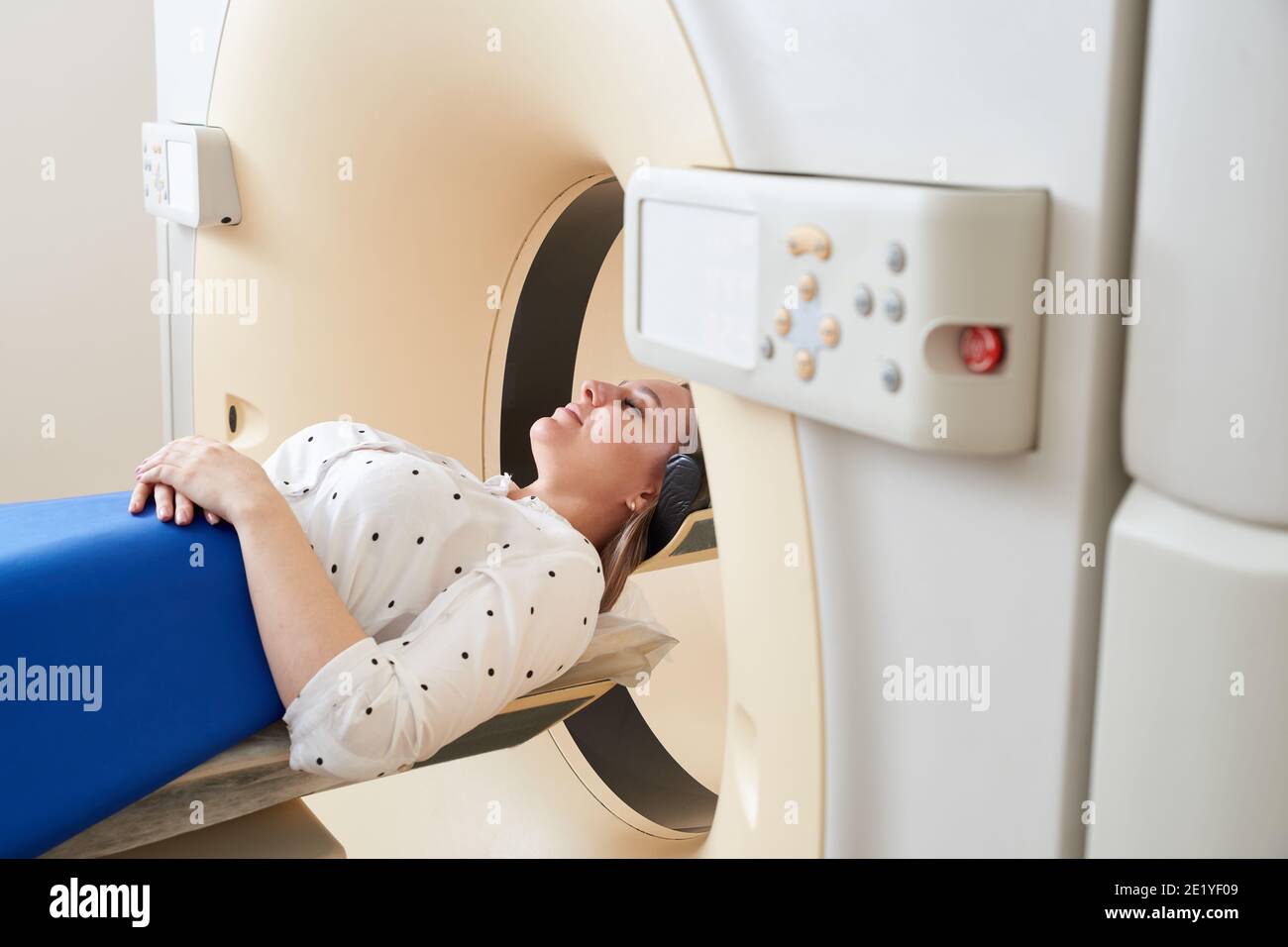 Female patient undergoing MRI - Magnetic resonance imaging in Hospital ...