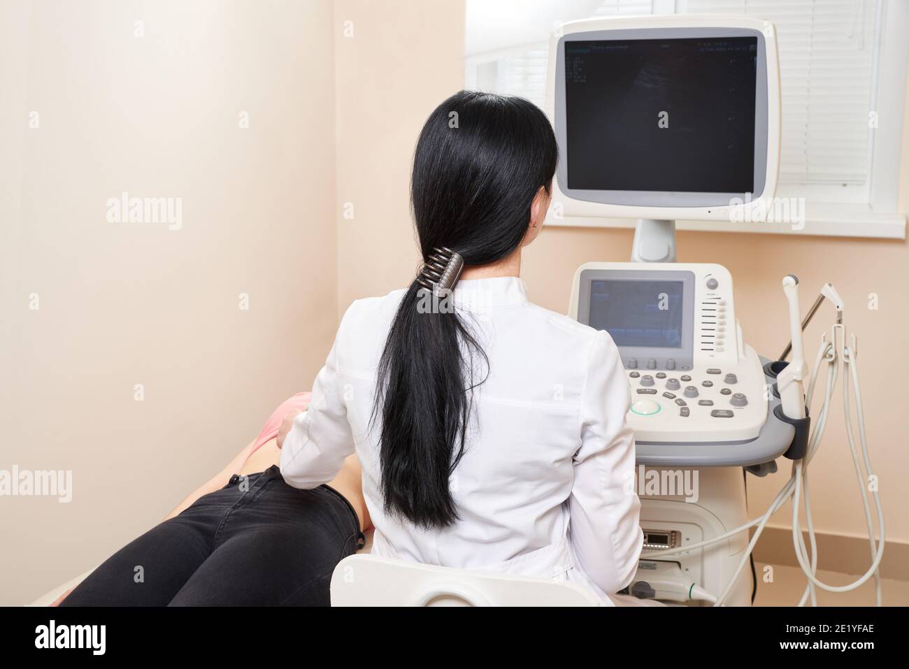 Woman doing pregnancy ultrasound in hi-res stock photography and images ...