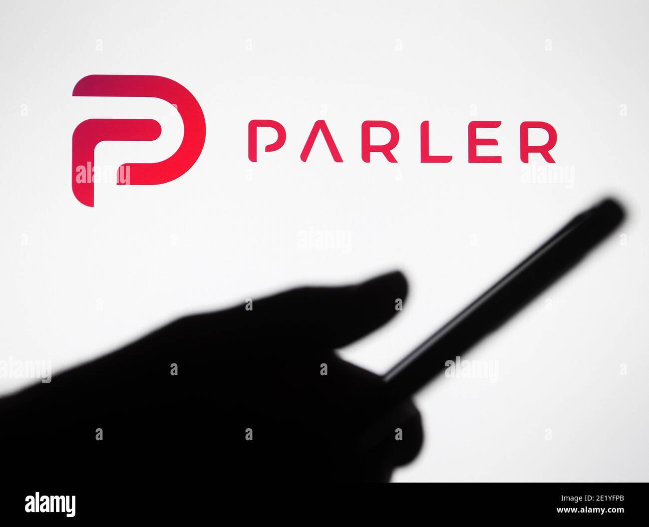 In this photo illustration the Parler logo seen in front of a ...
