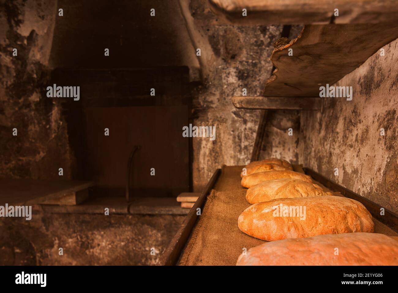 Freshly baked loaves of bread from an old oven Stock Photo - Alamy