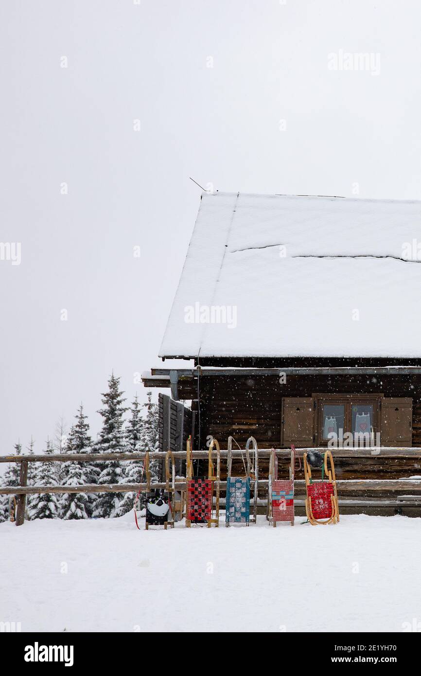 Sledges christmas tree wooden house snow hi-res stock photography and ...