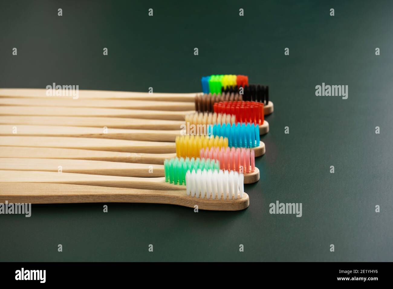 A set of Eco-friendly antibacterial toothbrushes made of bamboo wood on ...