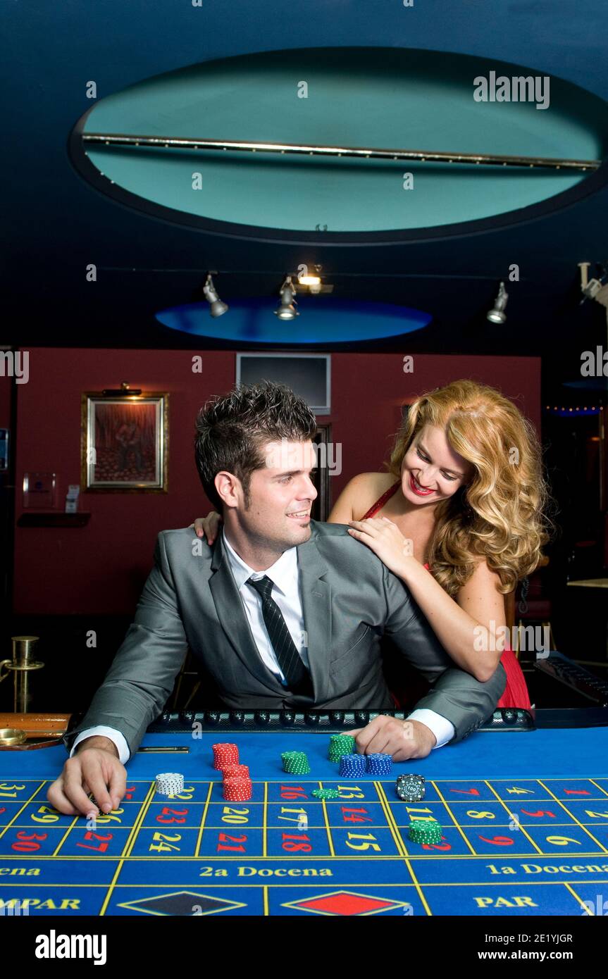 Couples gambling in casino hi-res stock photography and images - Alamy