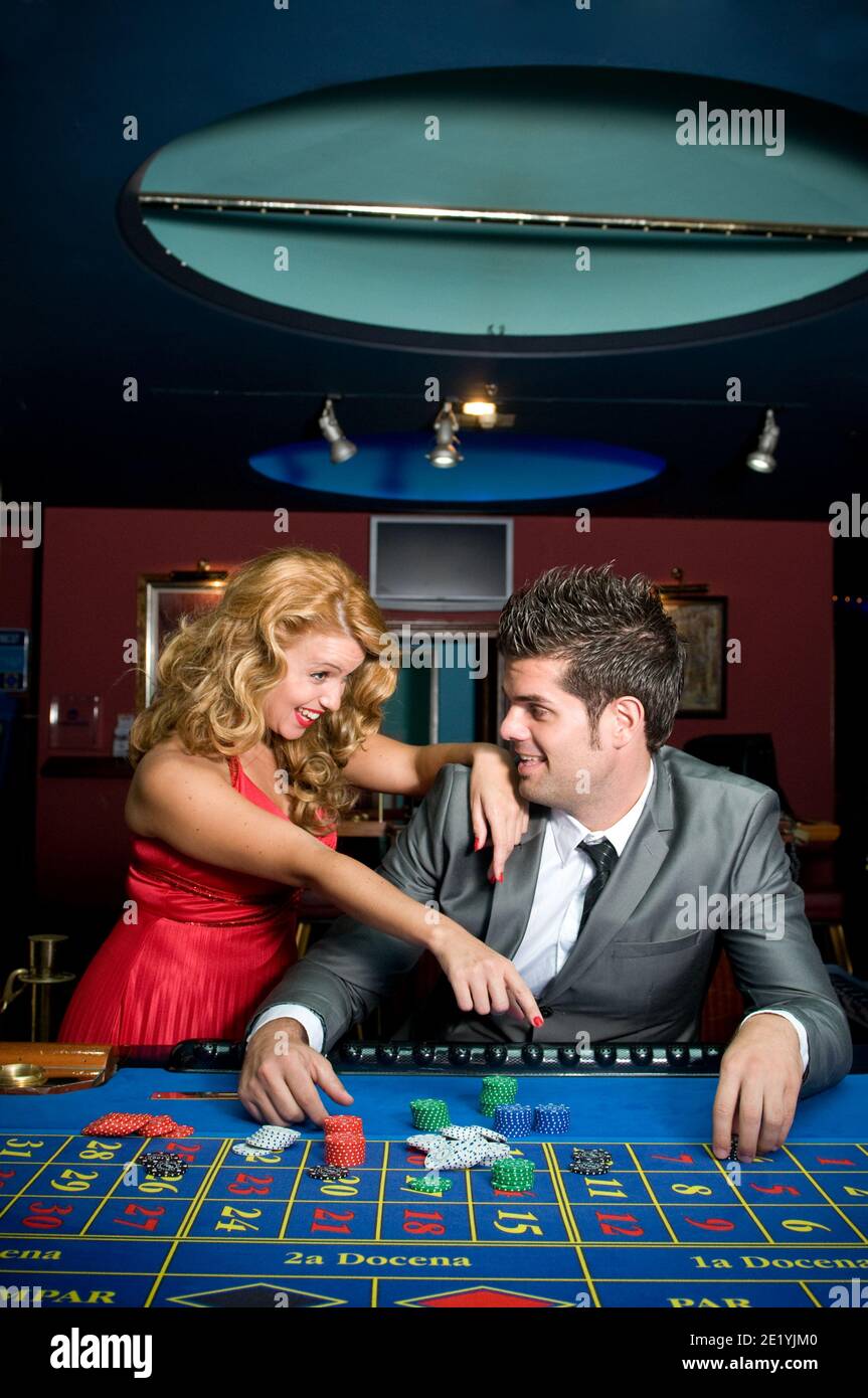 Couples gambling in casino hi-res stock photography and images - Alamy