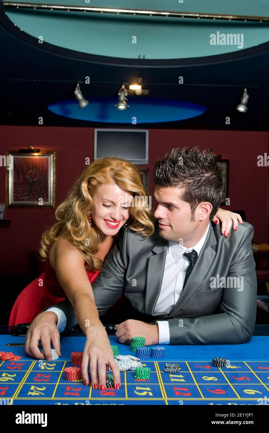 Couples gambling in casino hi-res stock photography and images - Alamy