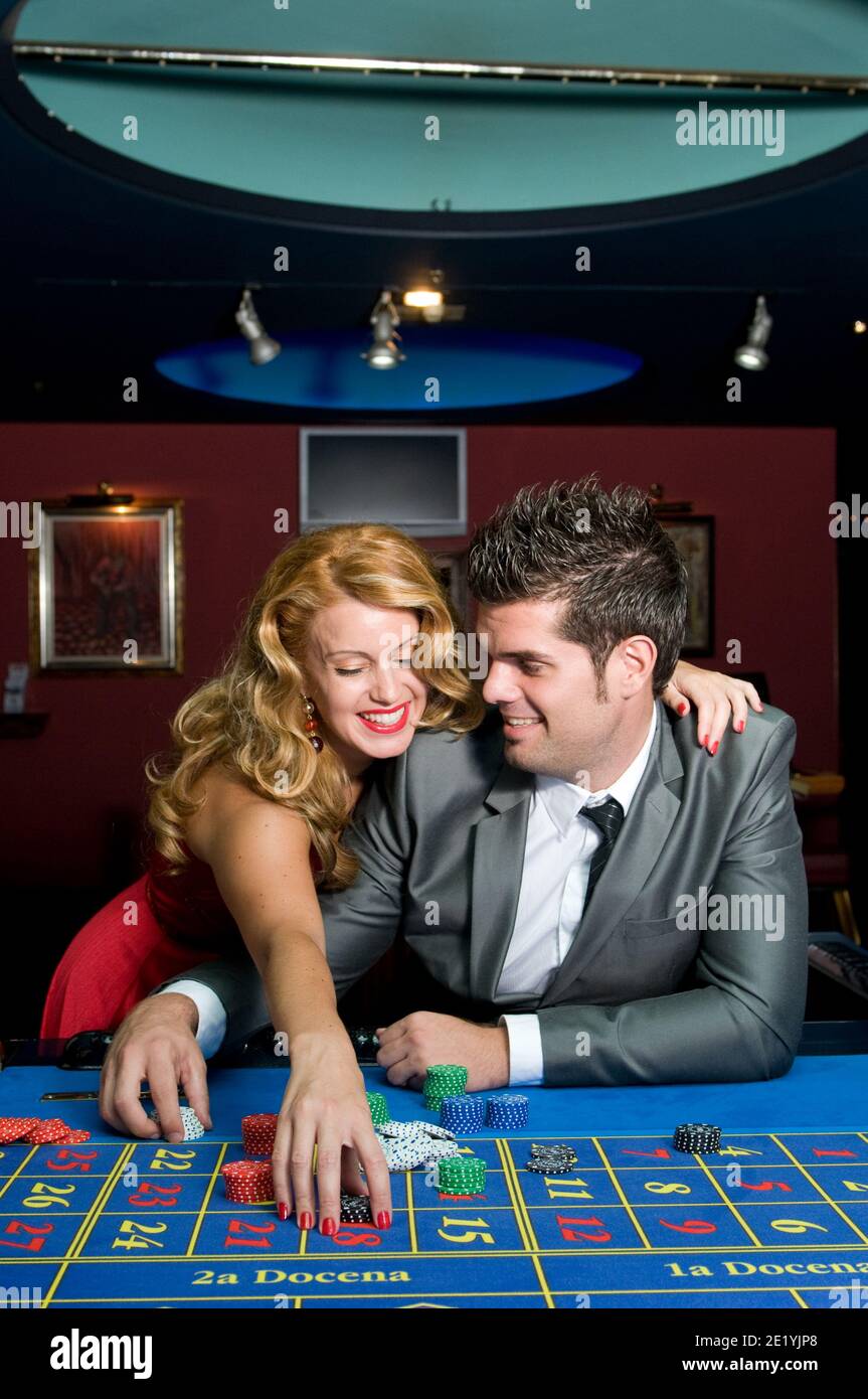 Couples gambling in casino hi-res stock photography and images - Alamy