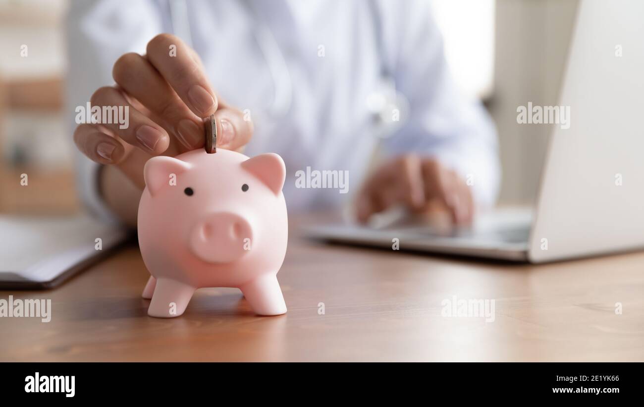 Close up young female doctor managing hospital budget Stock Photo - Alamy