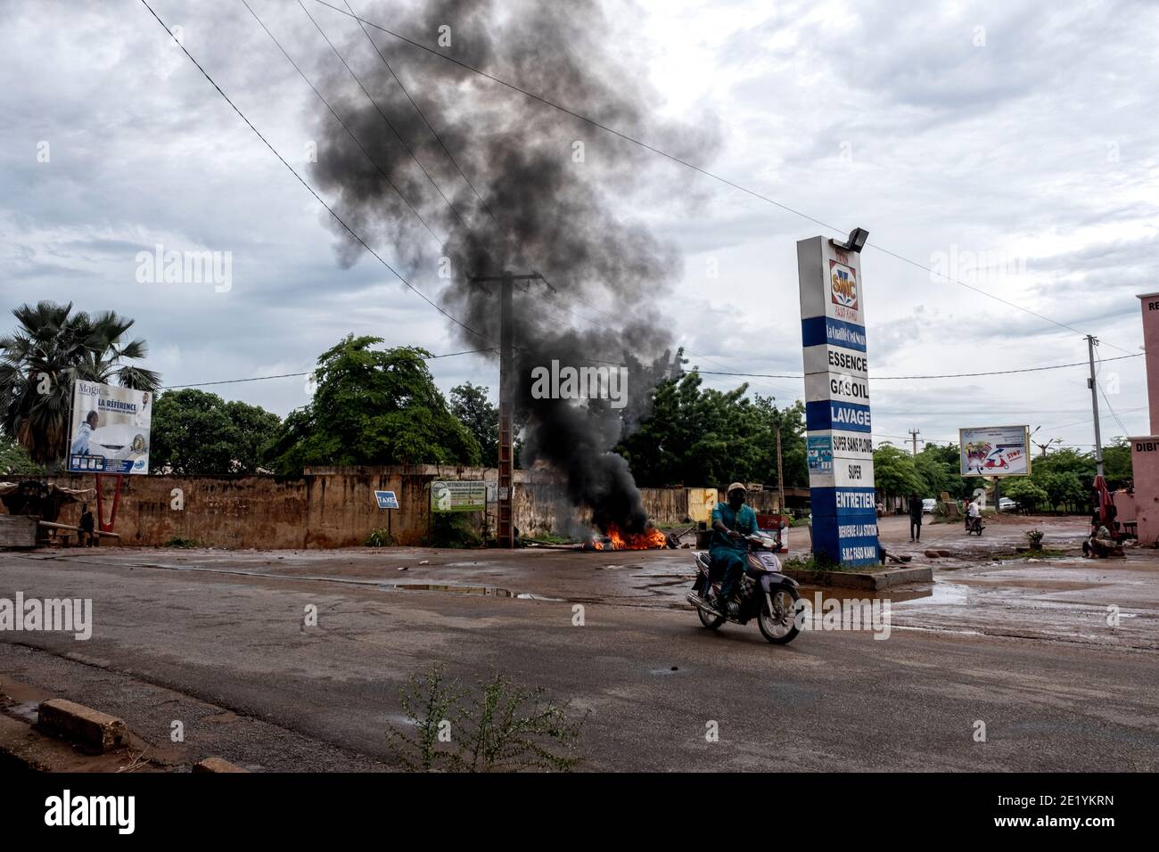 Smoke is seen billoing from roadblocks set up by protesters during ...