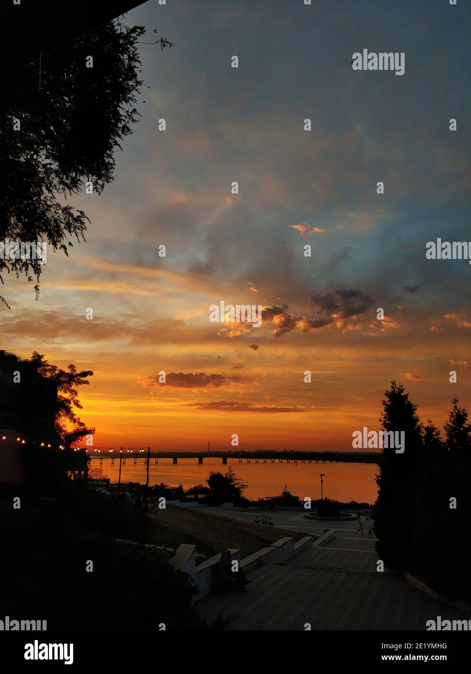 Natural landscape. Sunset over water, reflection of the sun and clouds ...